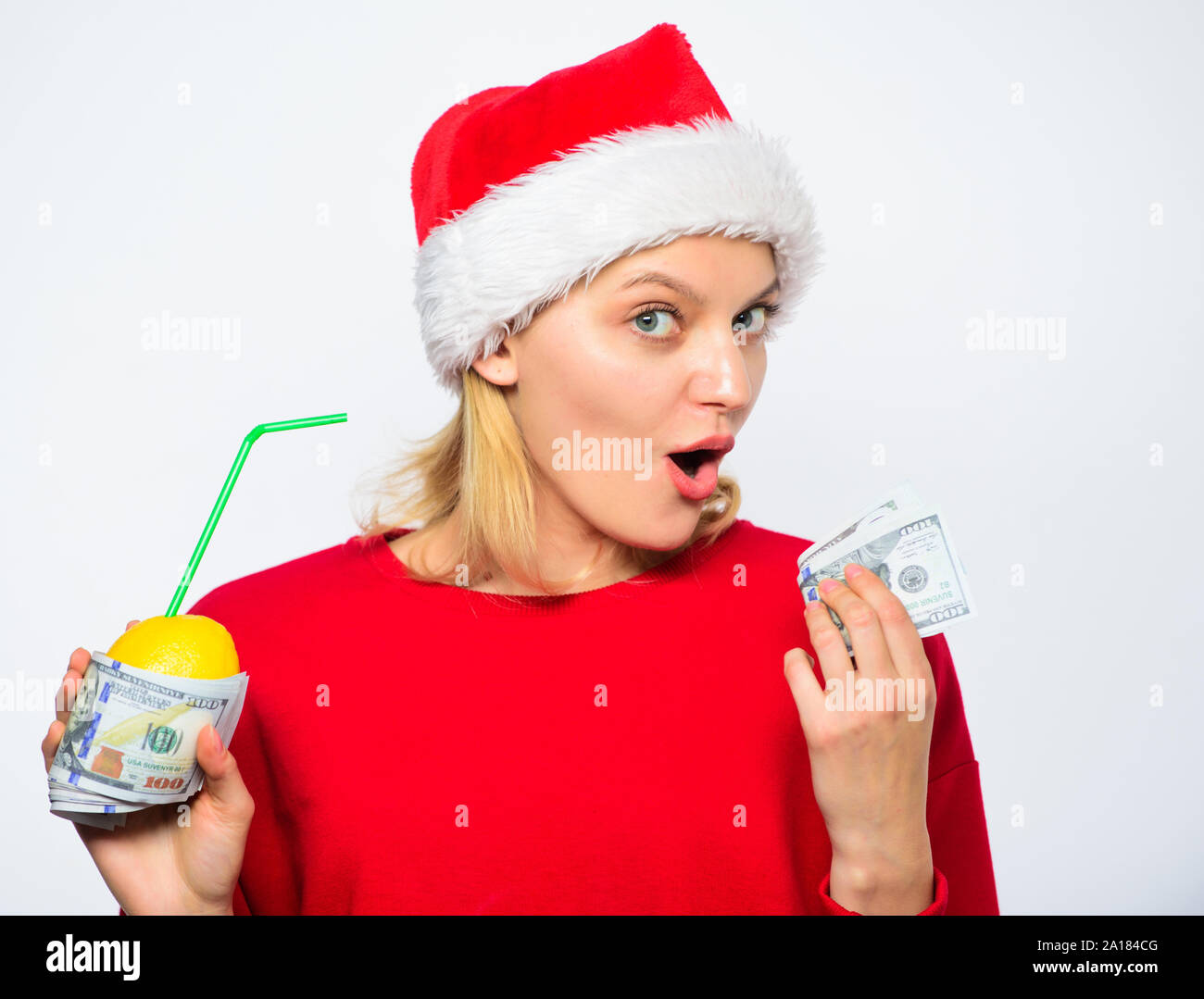 Girl santa hat drink juice lemon wrapped dollar banknote. Woman lemon ...