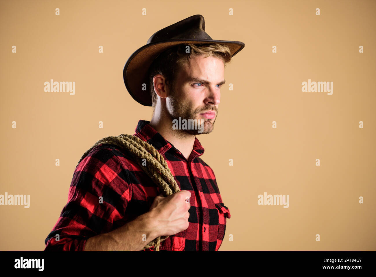 ready to ride. man checkered shirt on ranch. wild west rodeo. man in ...