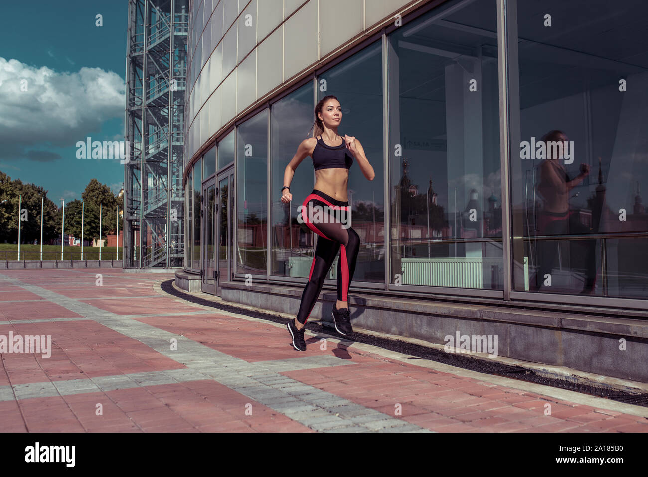 Stylish fashionable slender woman. Beautiful athletic tanned athlete ...
