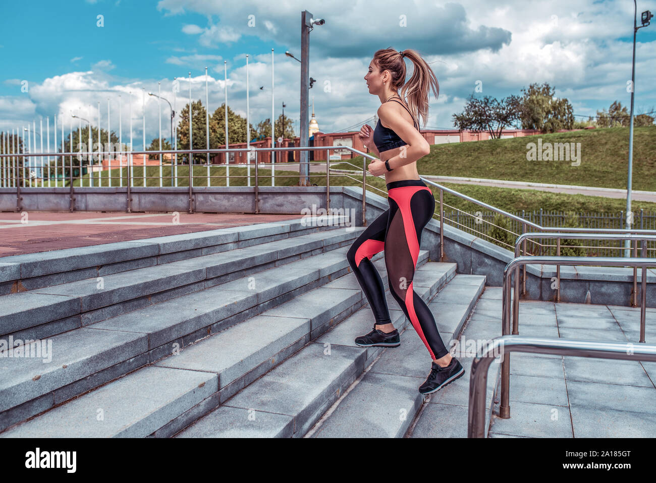 Summer sports girl in city runs for morning run, training, free space ...