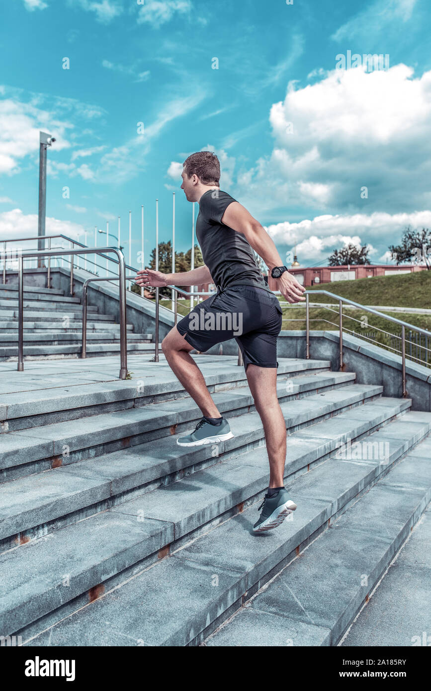Young man from back running hi-res stock photography and images - Alamy