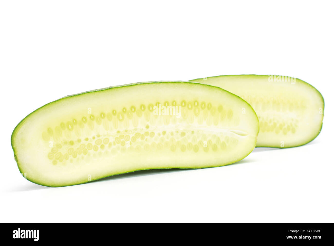 Group of two halves of fresh green pickling cucumber cross section ...