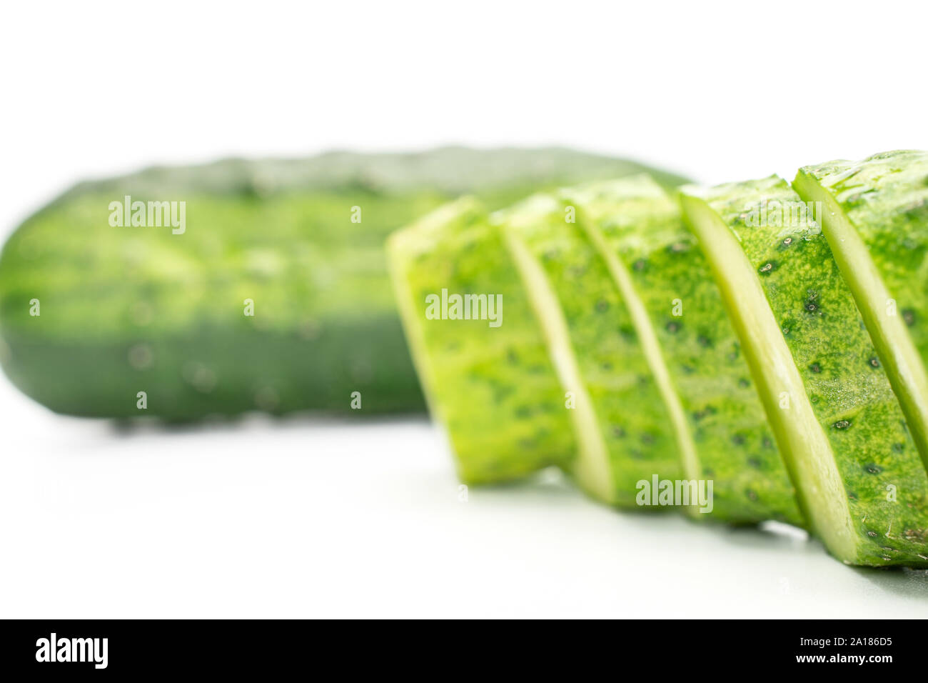 Group of one whole five slices of fresh green pickling cucumber ...