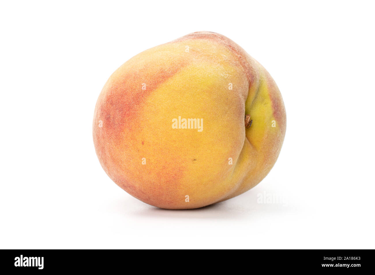 One whole fresh fuzzy peach isolated on white background Stock Photo ...