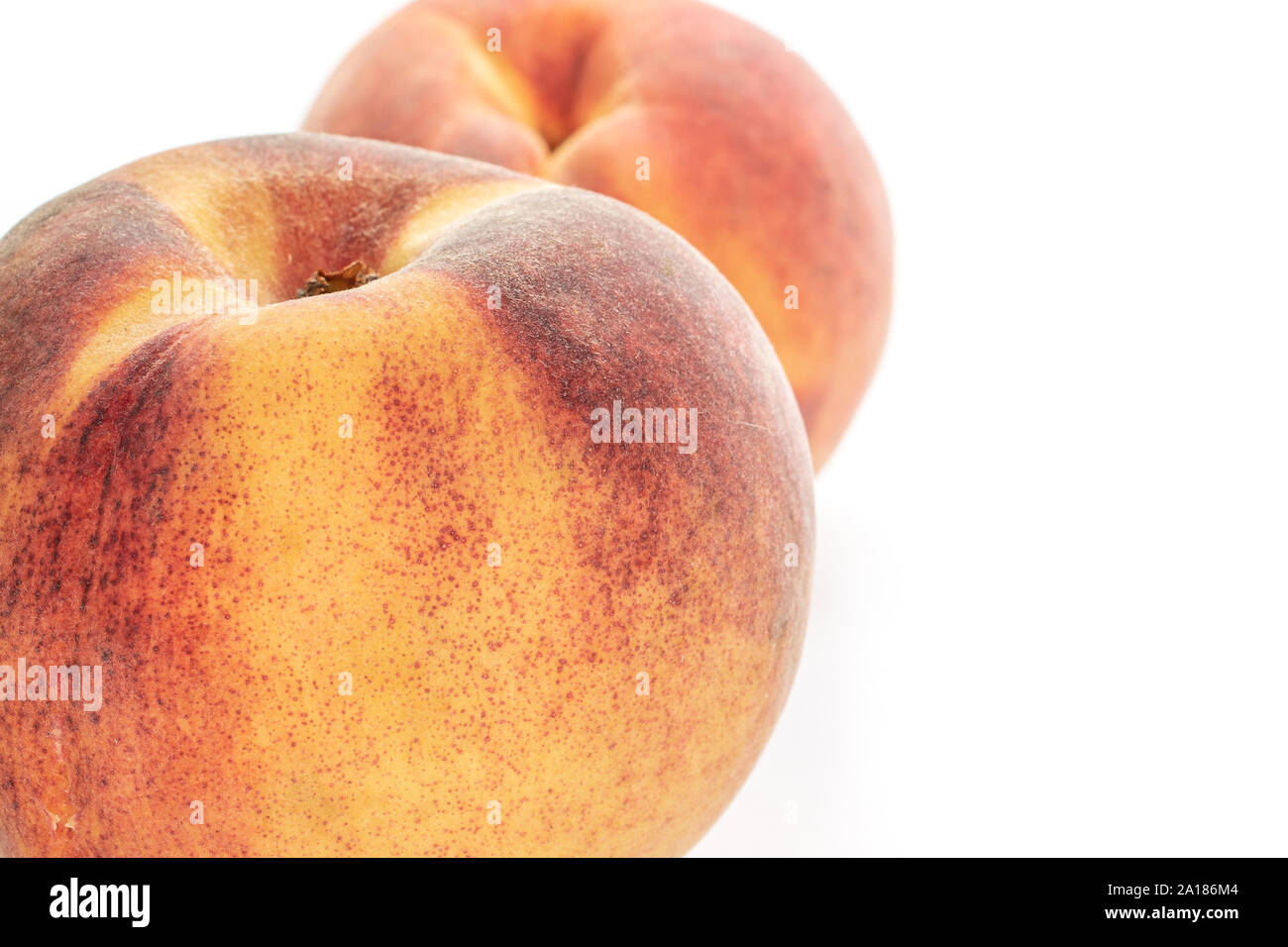 Group of two whole fresh fuzzy peach isolated on white background Stock ...
