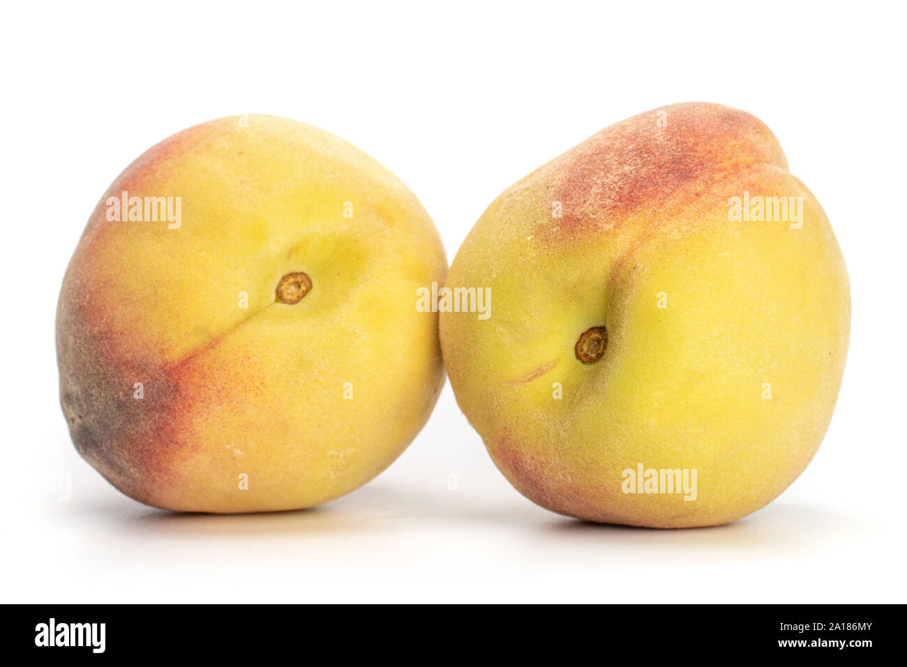 Group of two whole fresh fuzzy peach isolated on white background Stock ...
