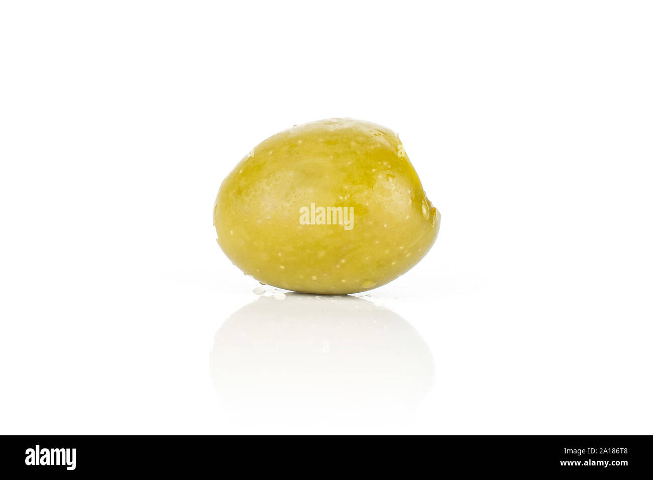 One whole pitted green olive isolated on white background Stock Photo ...