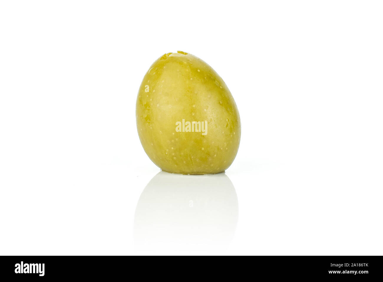 One whole small pitted green olive isolated on white background Stock ...