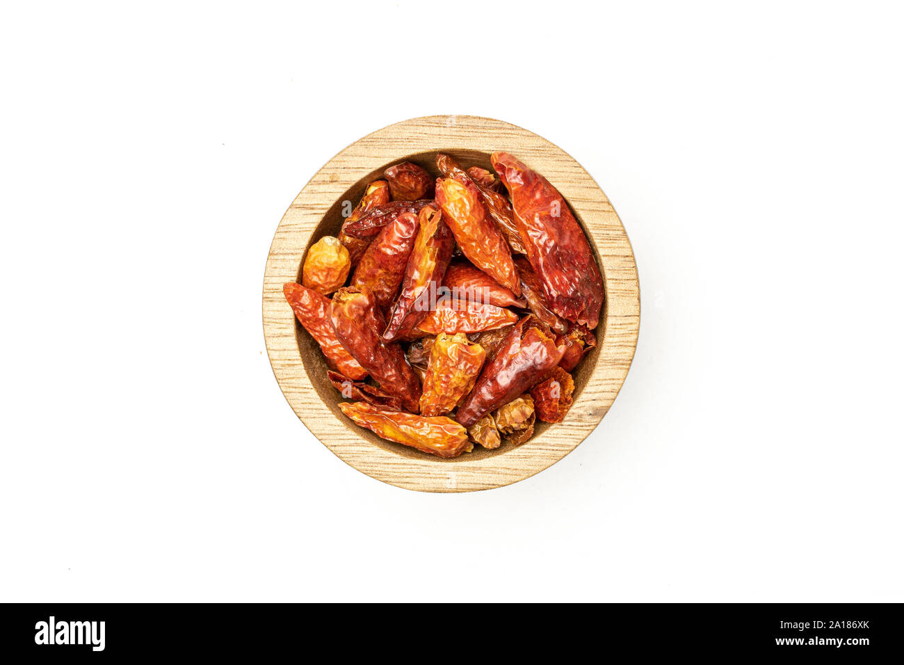 Lot of whole dry red chili pepper peperoncino in wooden bowl flatlay ...