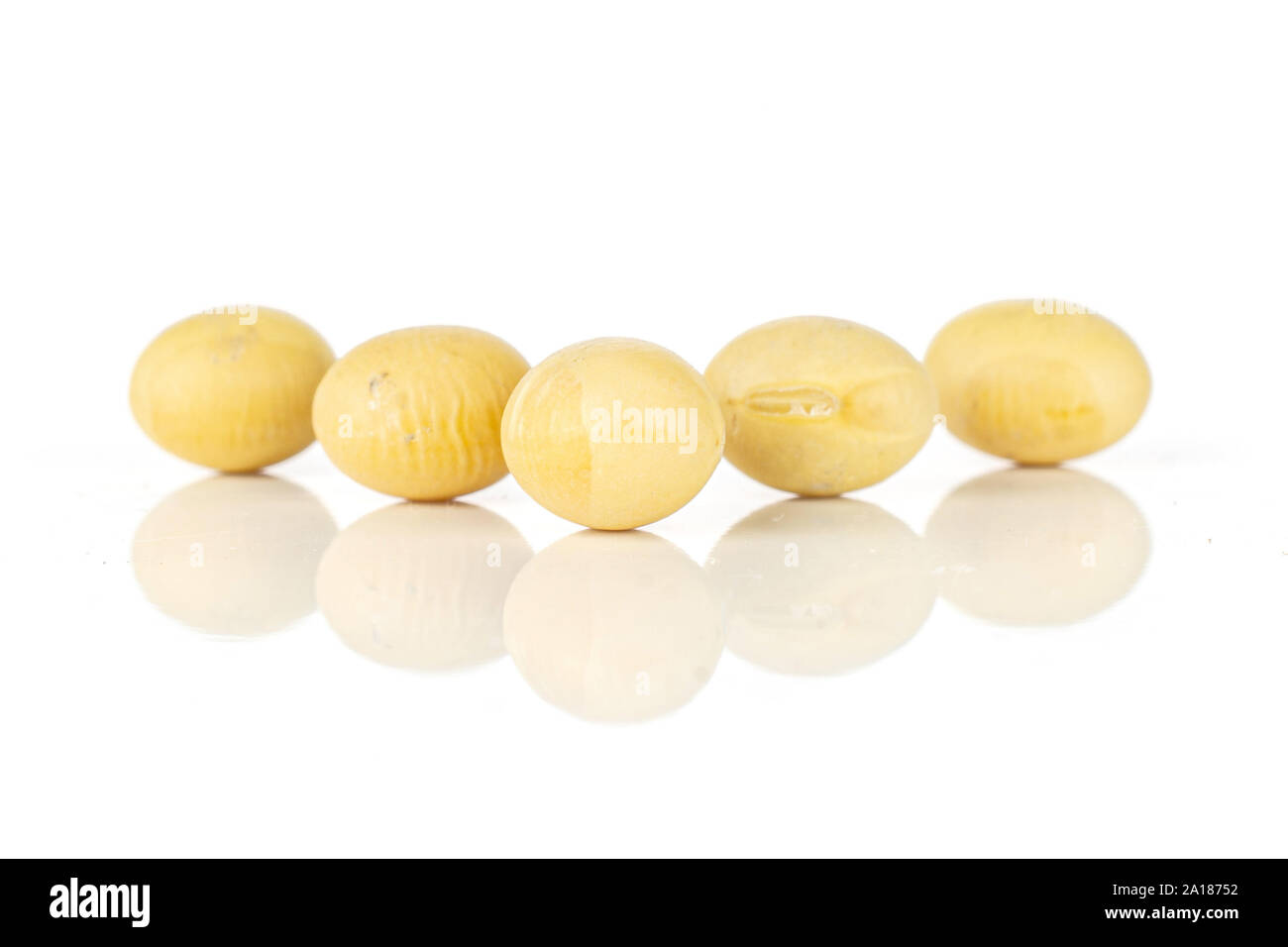 Group of five whole raw yellow soya bean triangle isolated on white ...