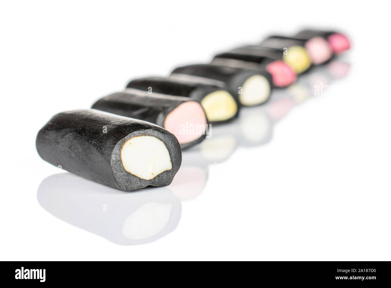 Group of eight whole sweet black liquorice candy isolated on white ...