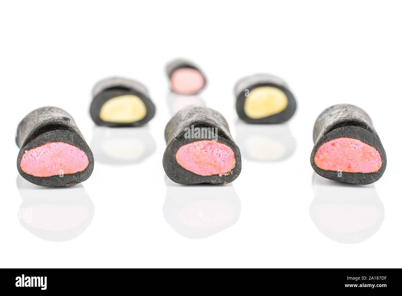 Group of six whole sweet black liquorice candy isolated on white ...