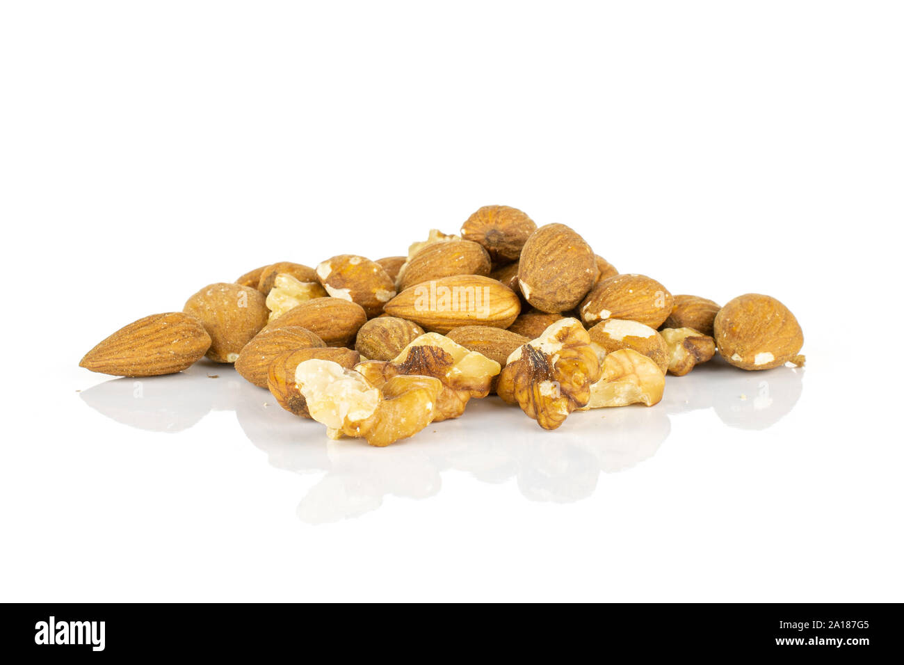Lot of whole brown almond nut isolated on white background Stock Photo ...