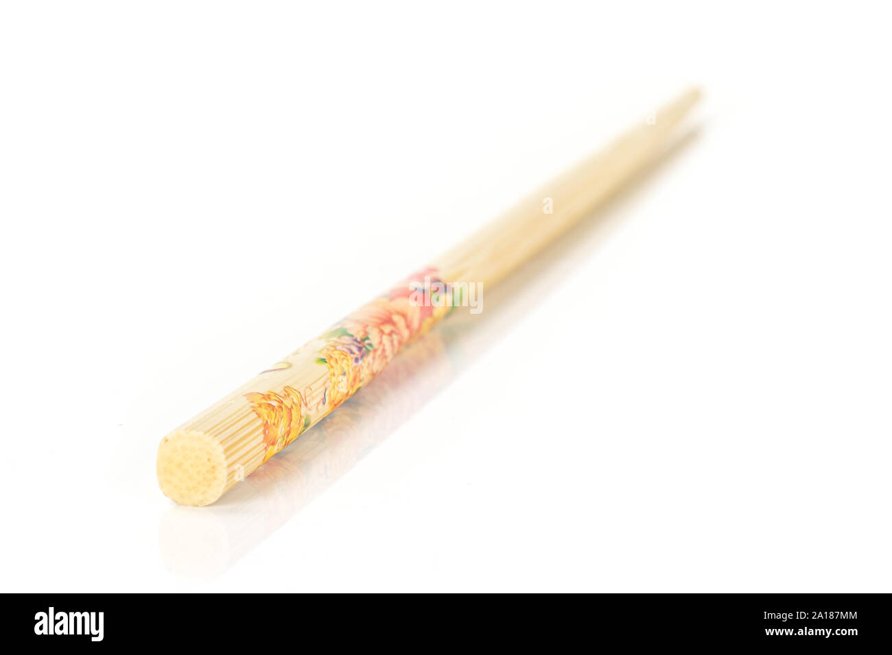 One whole asian brown chopsticks isolated on white background Stock ...