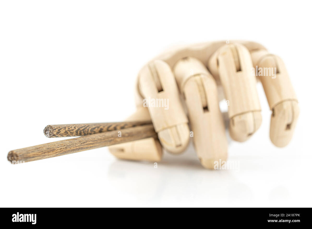 Group of two whole dark asian brown chopsticks with wooden hand ...
