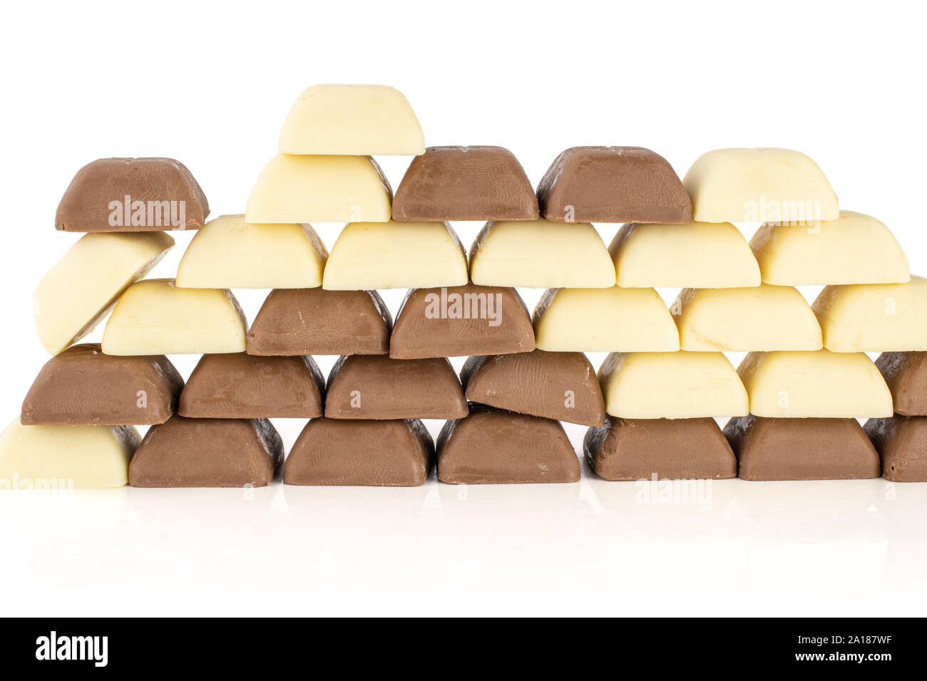 Lot of whole arranged fresh chocolate piece wall isolated on white ...