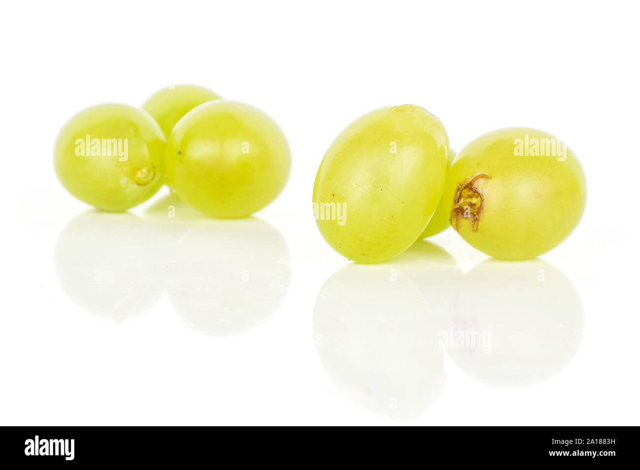 Lot of whole fresh green grape front focus isolated on white background ...