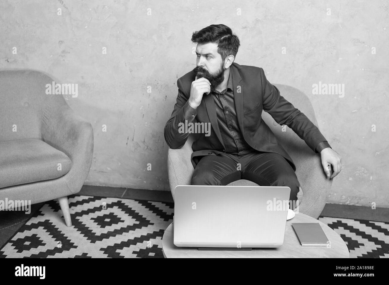 Thoughtful businessman think online Black and White Stock Photos ...