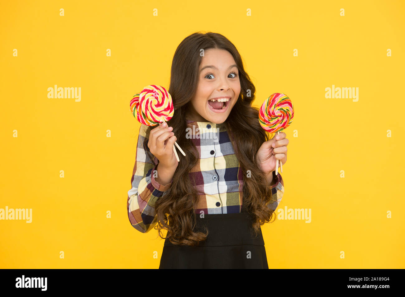 Happy kid with candy. School nutrition. Calories and energy. Harmful ...