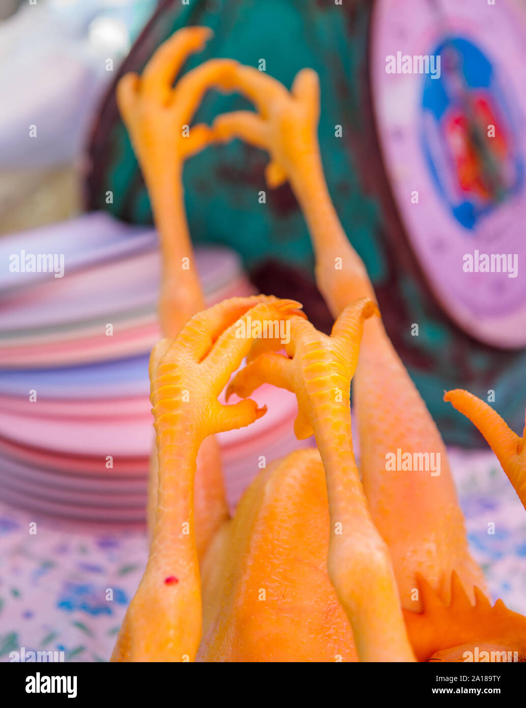 Fresh, recently deceased chicken and their upright succulent feet on ...