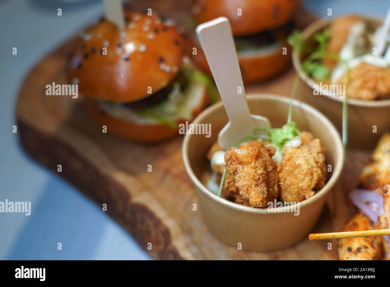 appetizer platter of small burgers and calamari Stock Photo - Alamy