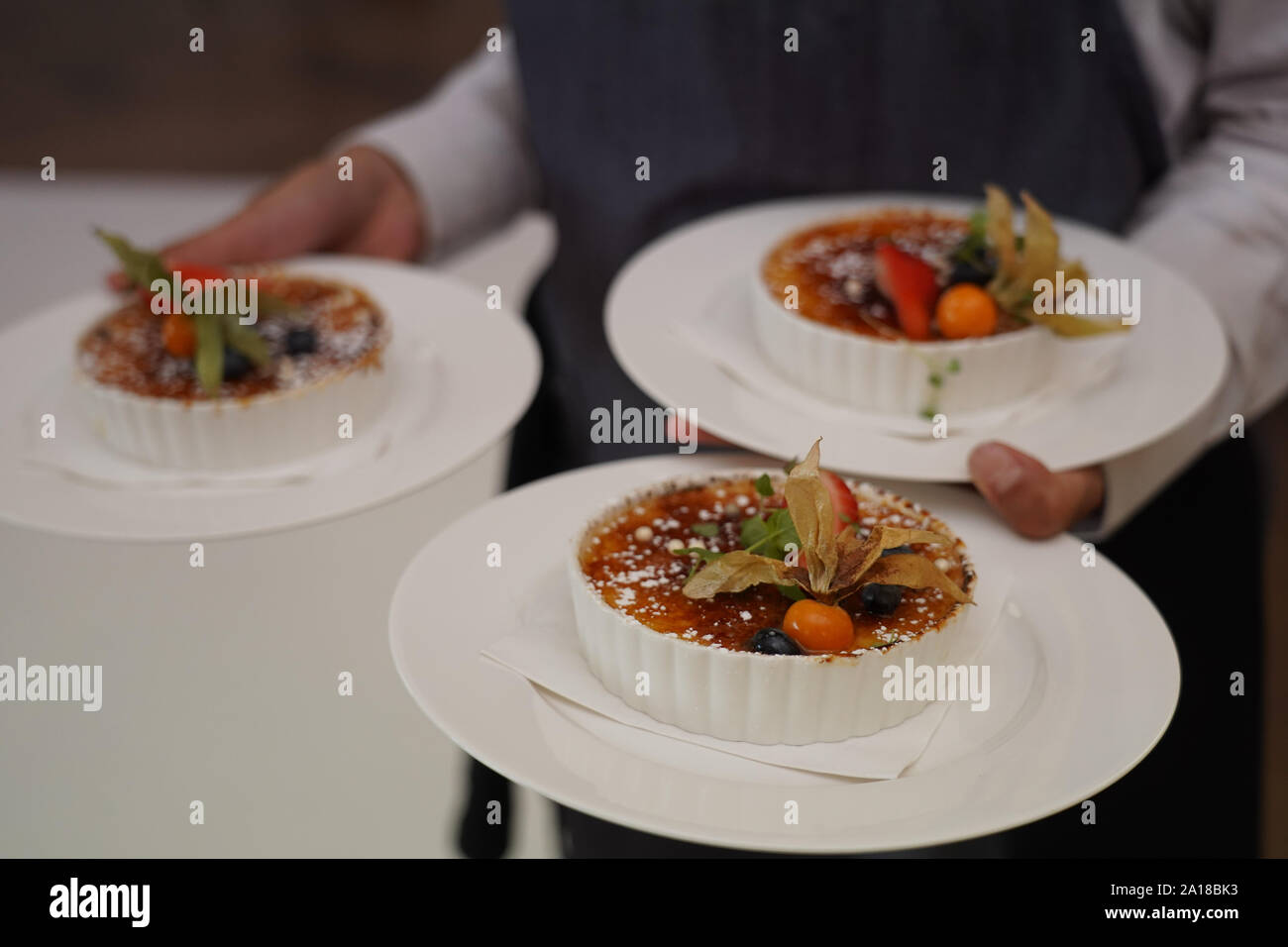 Male server carrying plates hi-res stock photography and images - Alamy