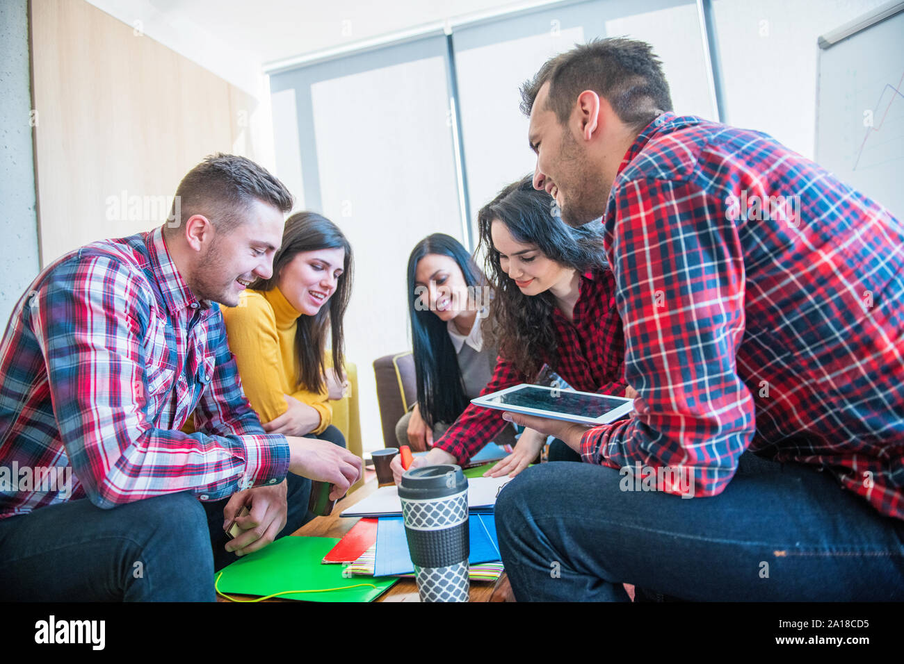 Diverse female colleagues chatting workplace hi-res stock photography ...