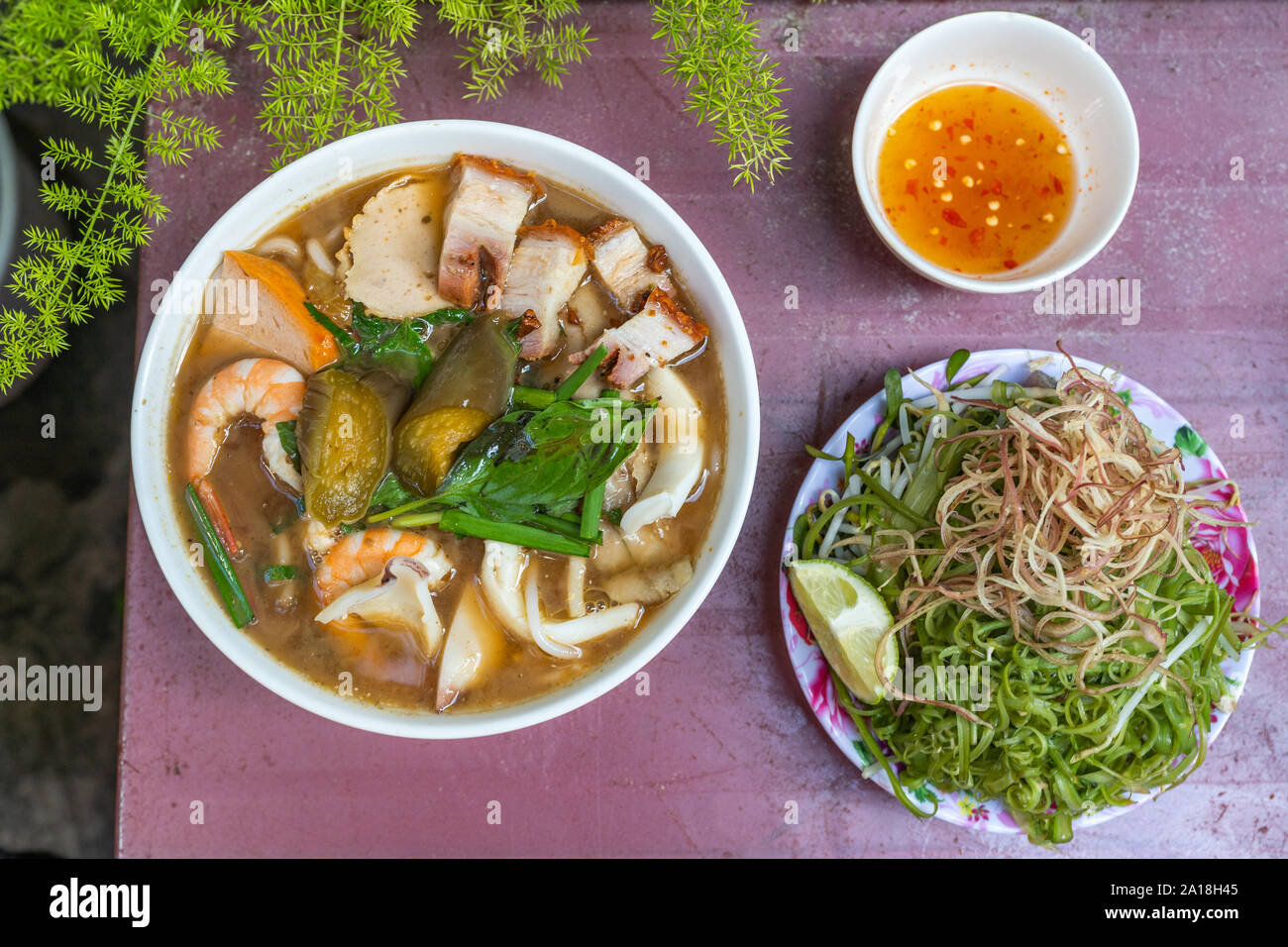 Bowl of traditional Vietnamese roasted pork and shrimp noodles soup ...