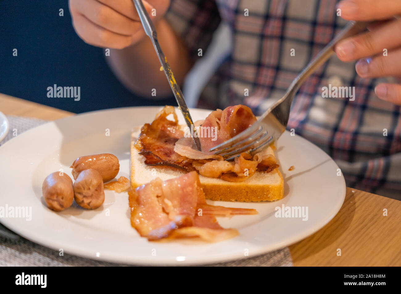 Man eating sausage bacon hi-res stock photography and images - Alamy