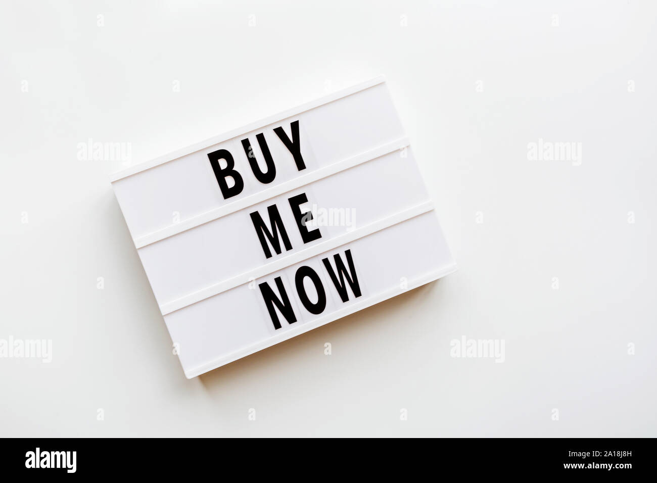 Creative promotion composition buy me now text on lightbox on white ...