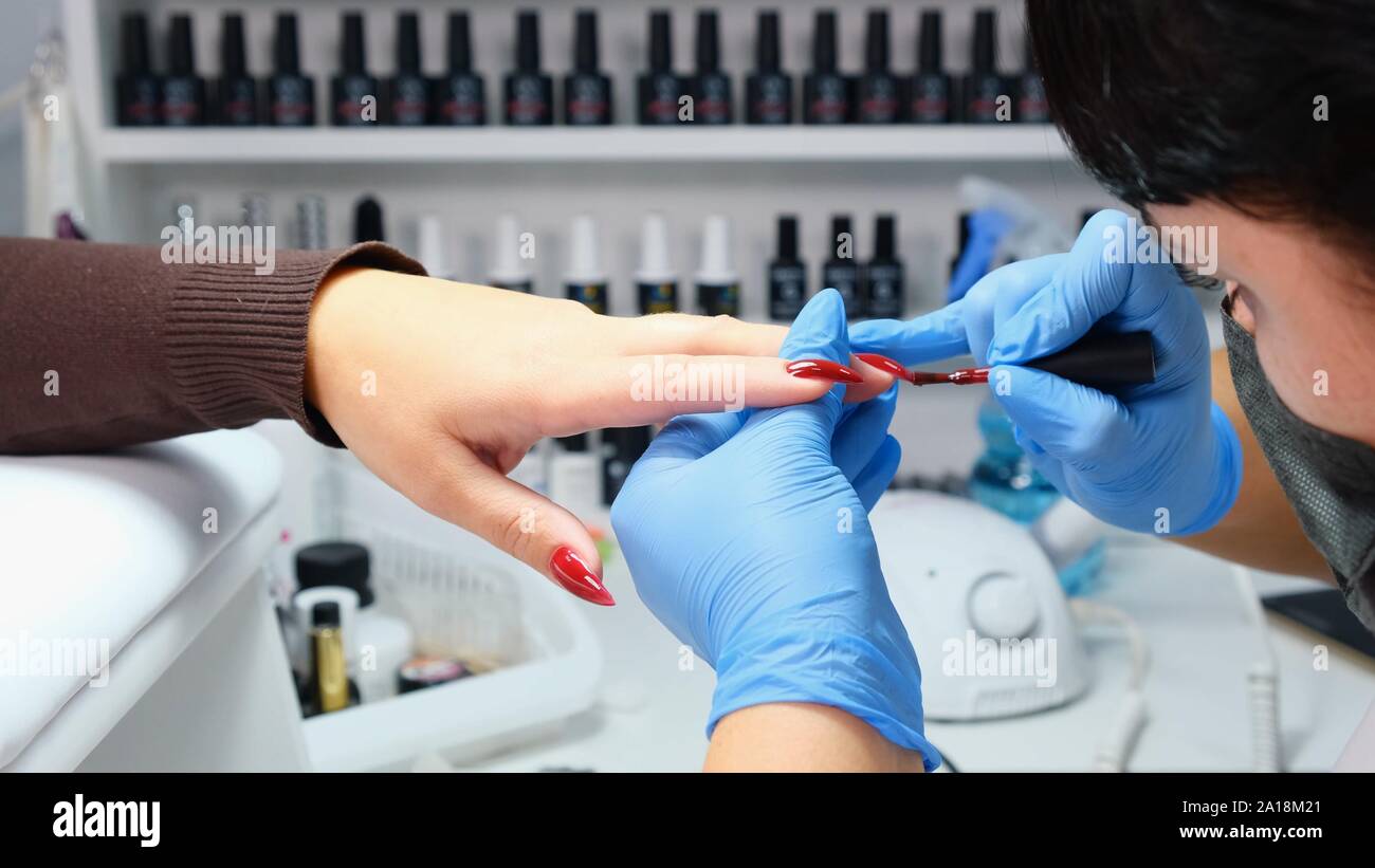 Manicurist drawing on nail close hi-res stock photography and images ...