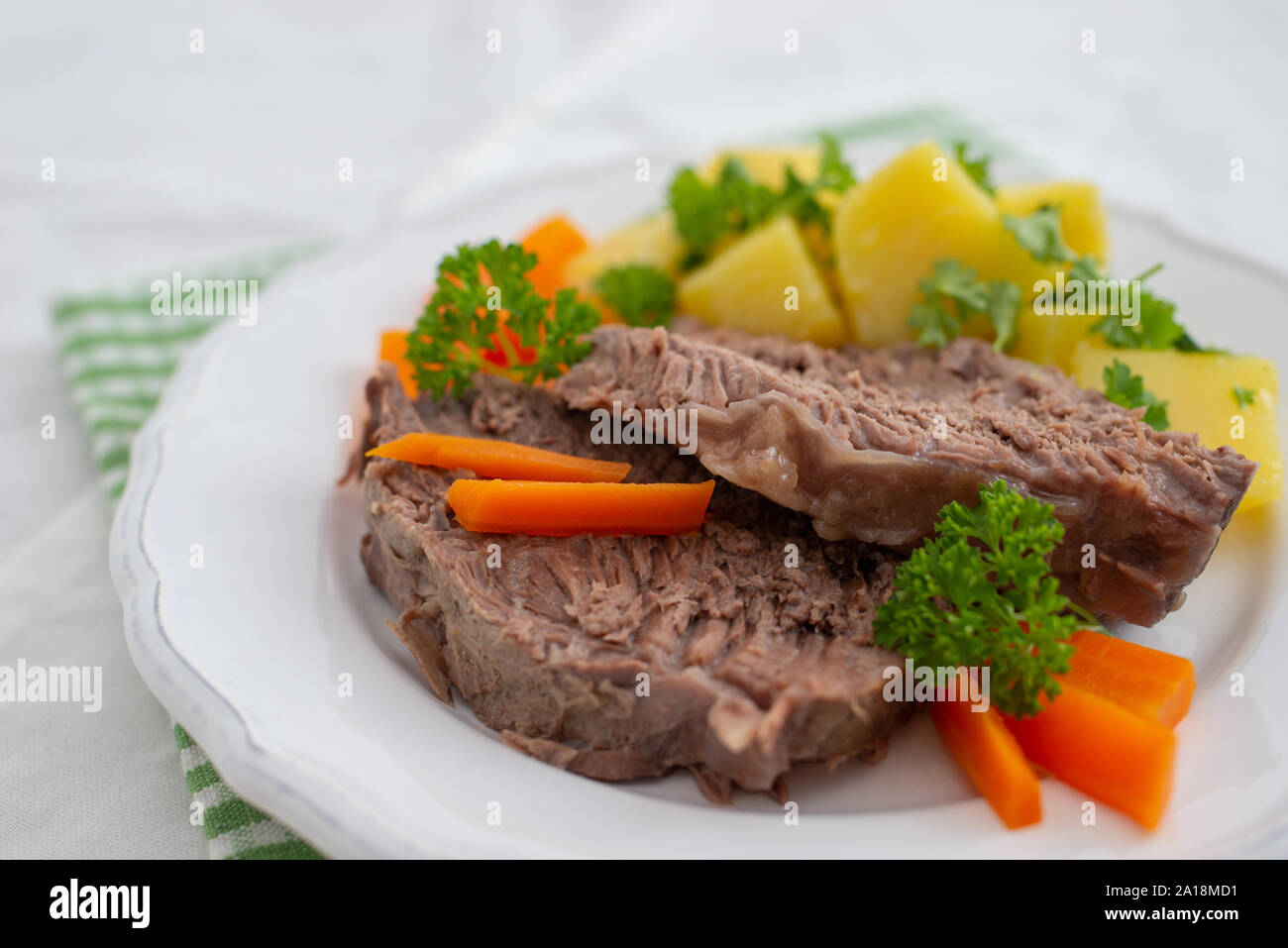 Prime boiled beef with root vegetables, Viennese Tafelspitz Stock Photo ...