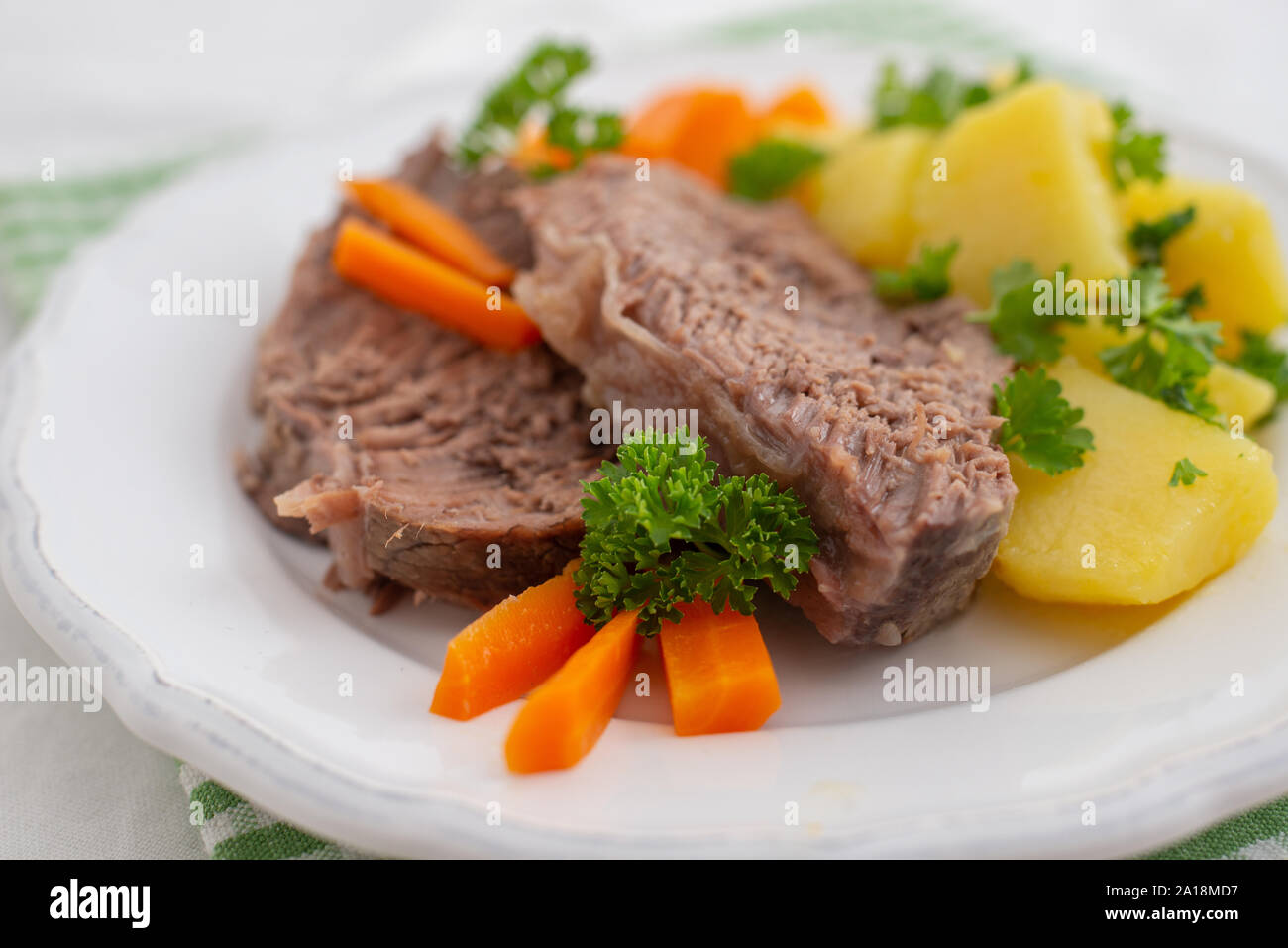 Prime boiled beef with root vegetables, Viennese Tafelspitz Stock Photo ...