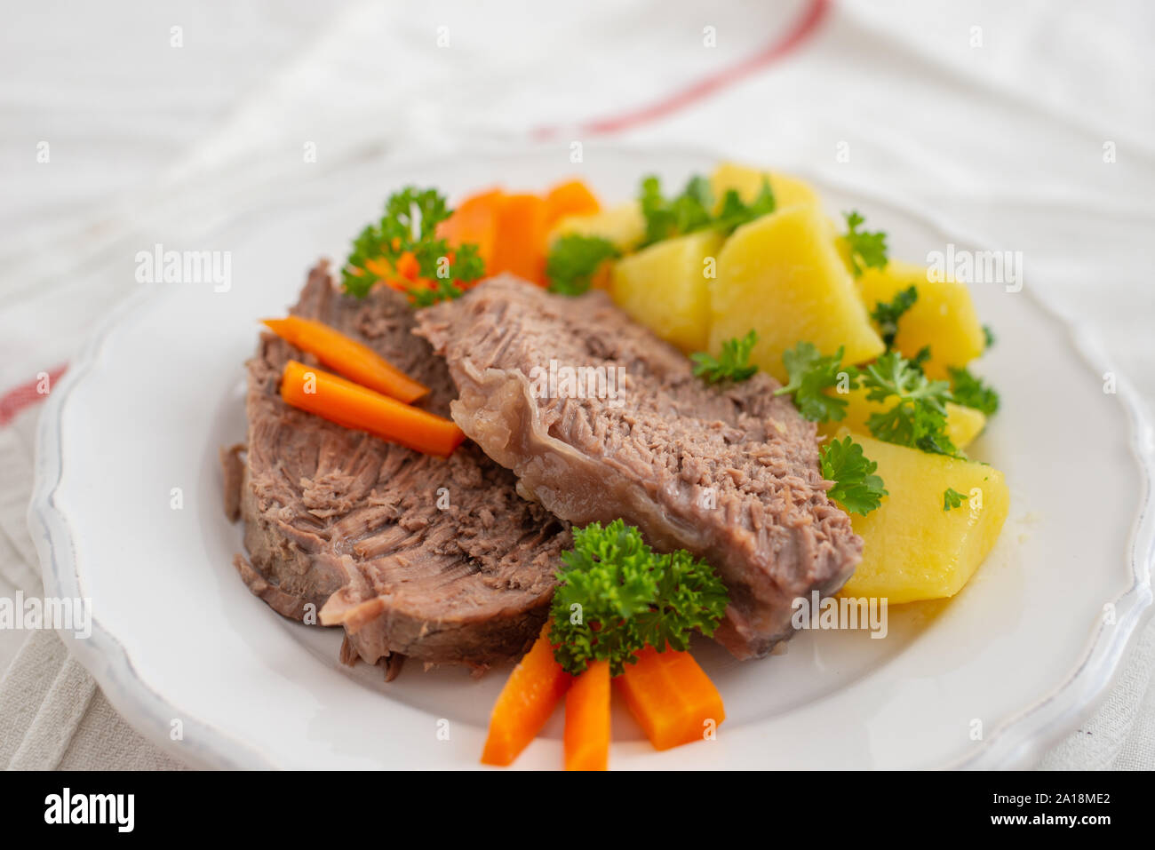 Prime boiled beef with root vegetables, Viennese Tafelspitz Stock Photo ...