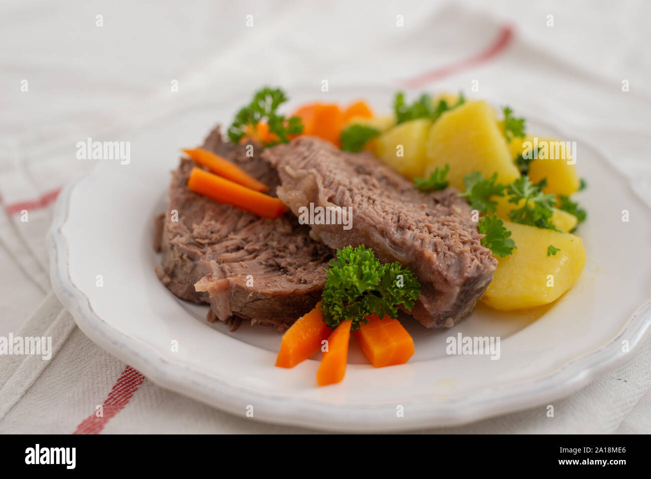 Prime boiled beef with root vegetables, Viennese Tafelspitz Stock Photo ...
