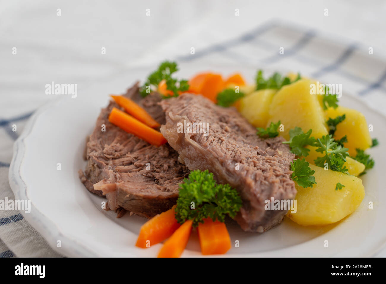 Prime boiled beef with root vegetables, Viennese Tafelspitz Stock Photo ...