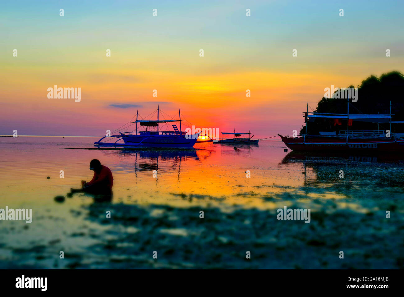 Diving Canoes in Sipalay City Sunset Stock Photo - Alamy