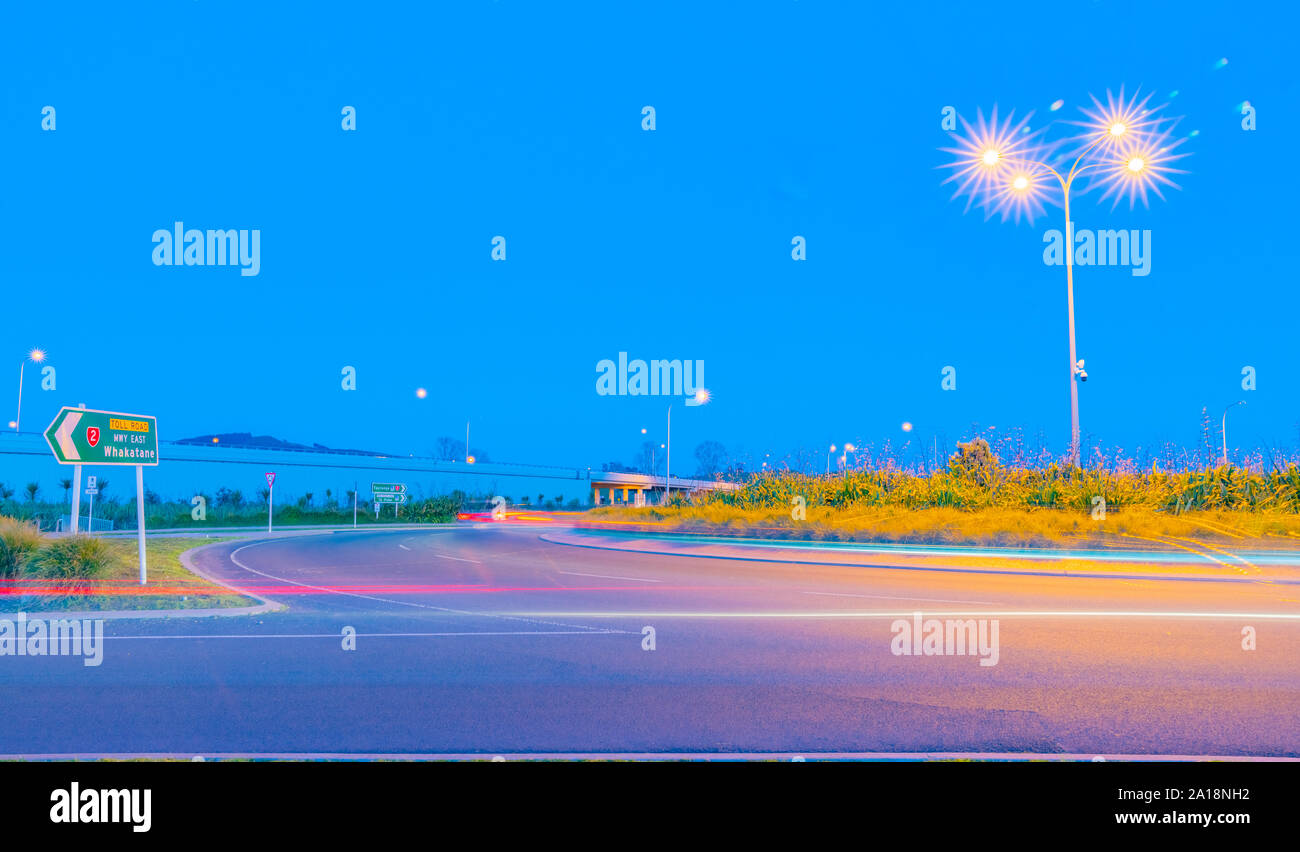 Intersection and roundabout with direction sign to Whakatane, street ...
