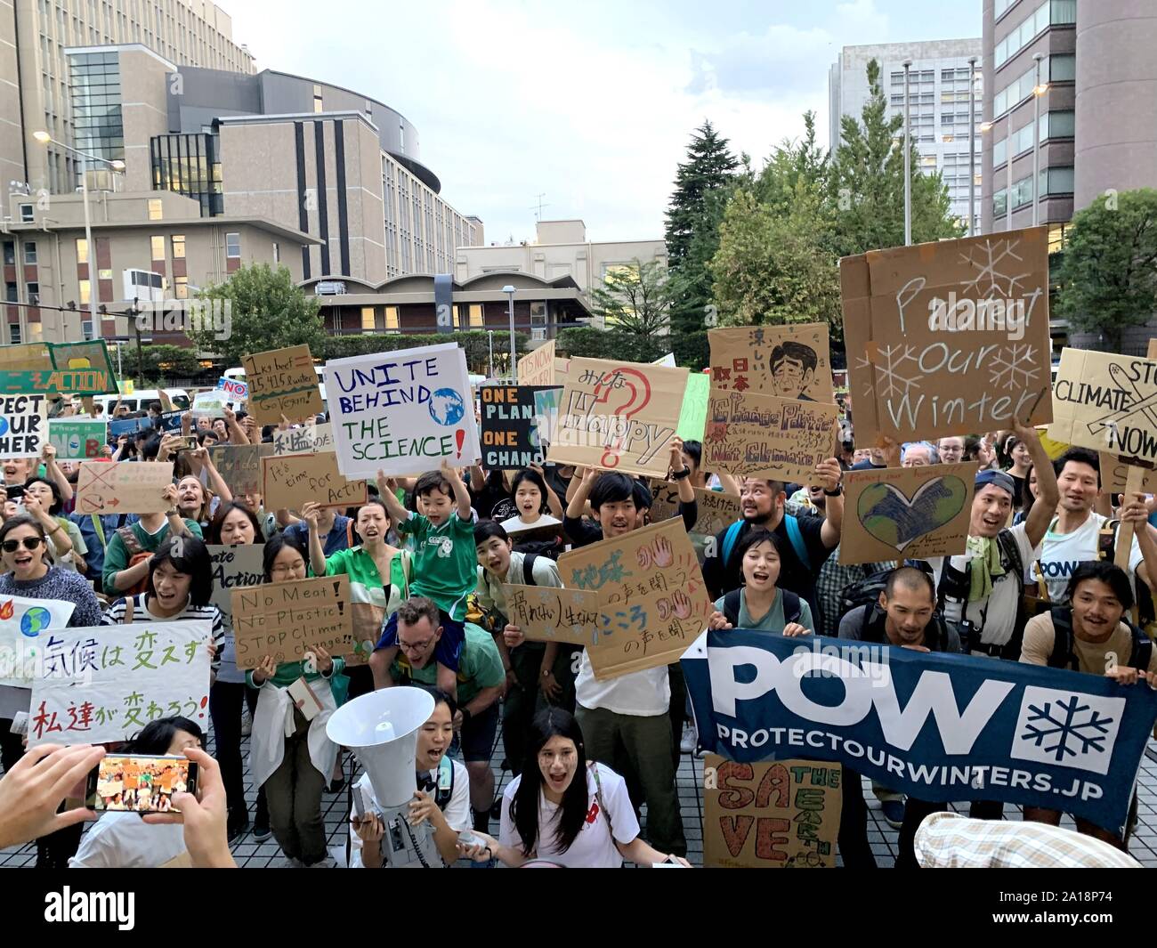 People attend a protest march as part of the worlds largest climate ...