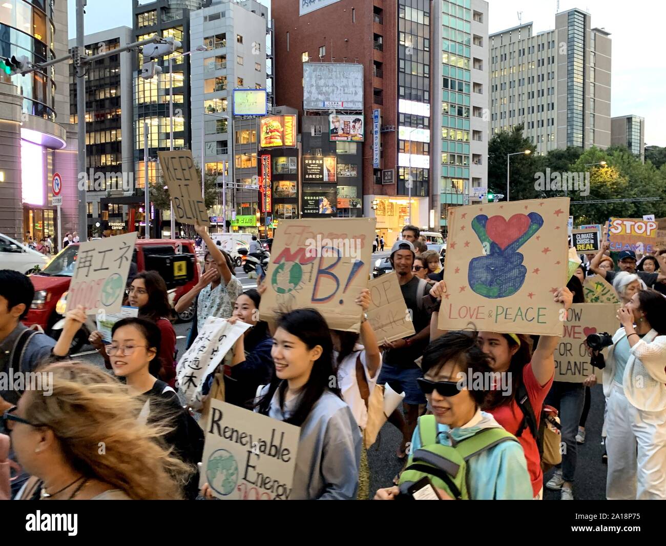 People attend a protest march as part of the worlds largest climate ...