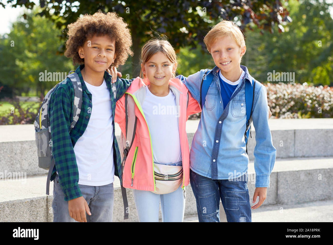 Children friends walking school backpacks hi-res stock photography and ...