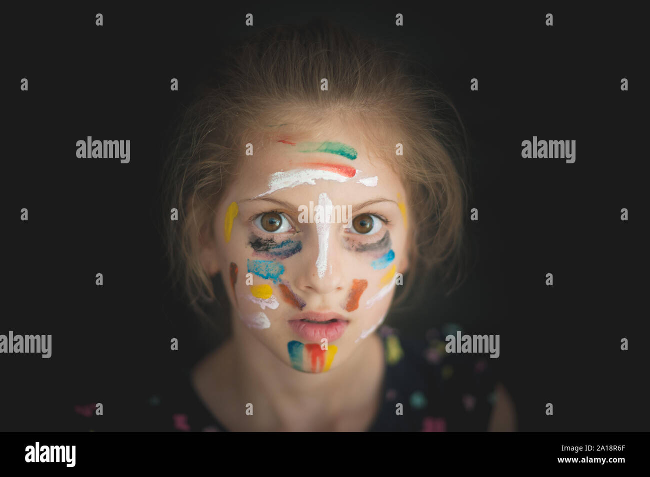 beautiful portrait of little caucasian girl face with colorful art ...