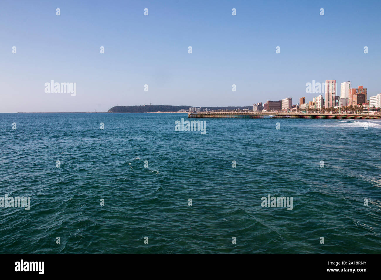 Sea off durban beach with pier and bluff in background Stock Photo - Alamy