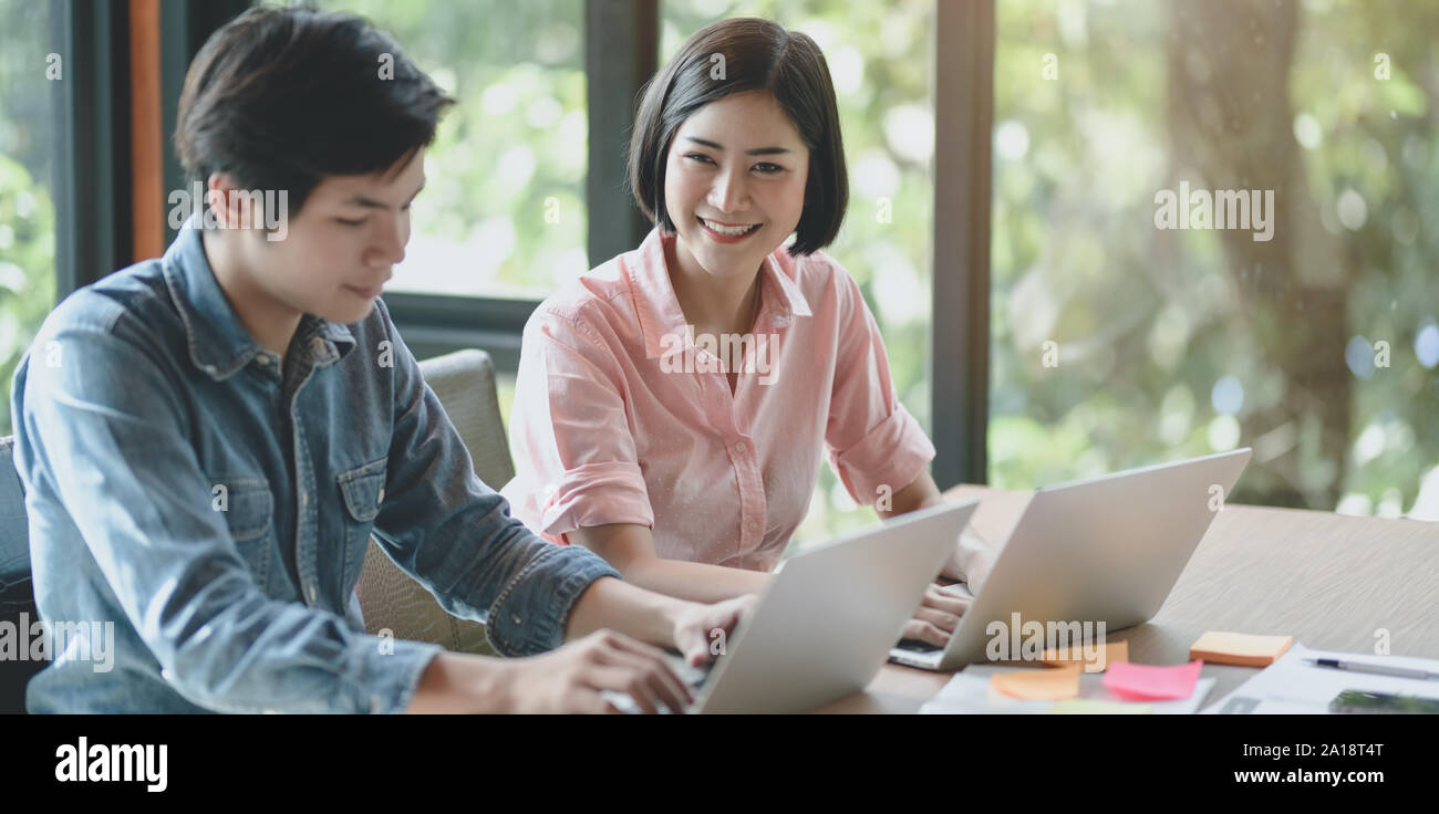 Team of UI web developer working on their project on smartphone ...