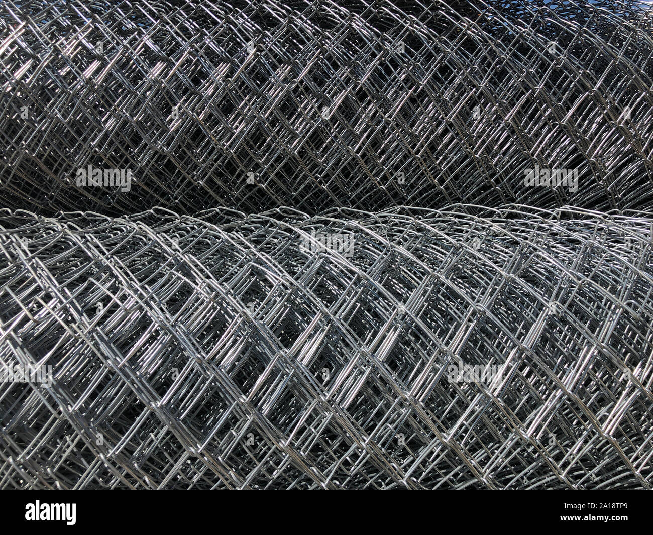 Rolled chain-link fence. Metal mesh netting rolled into rolls Stock ...