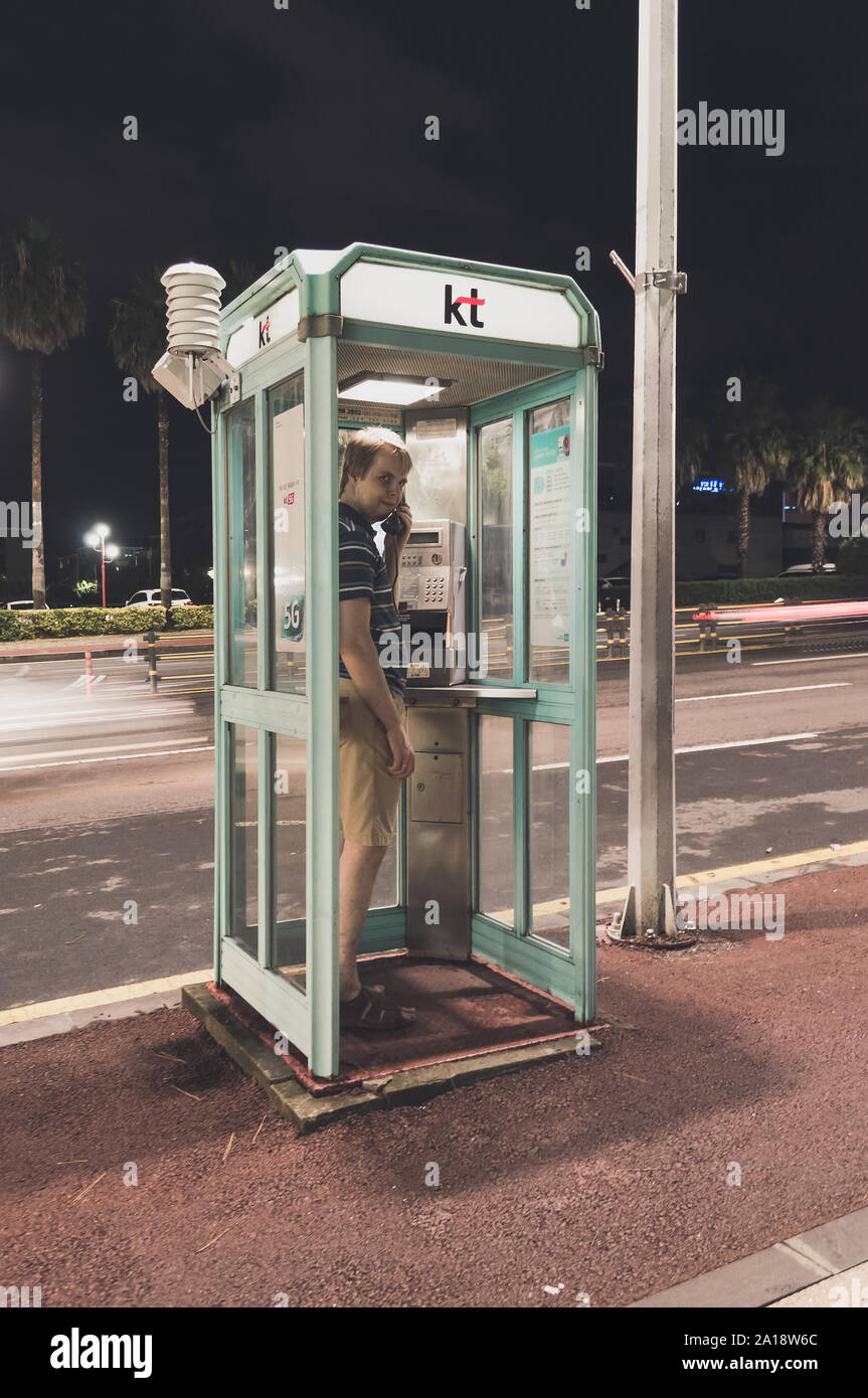 Jeju, South Korea, september 03, 2019: man is using KT phone booth at ...