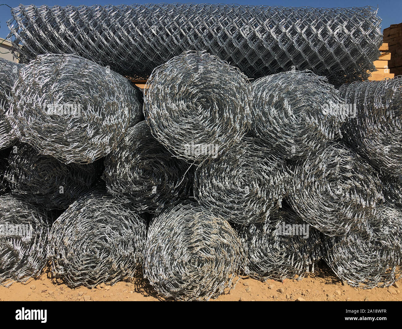 Rolled chain-link fence. Metal mesh netting rolled into rolls Stock ...