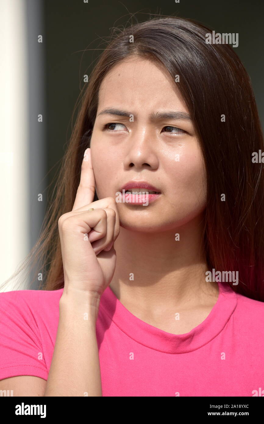 A Thoughtful Asian Female Woman Stock Photo - Alamy