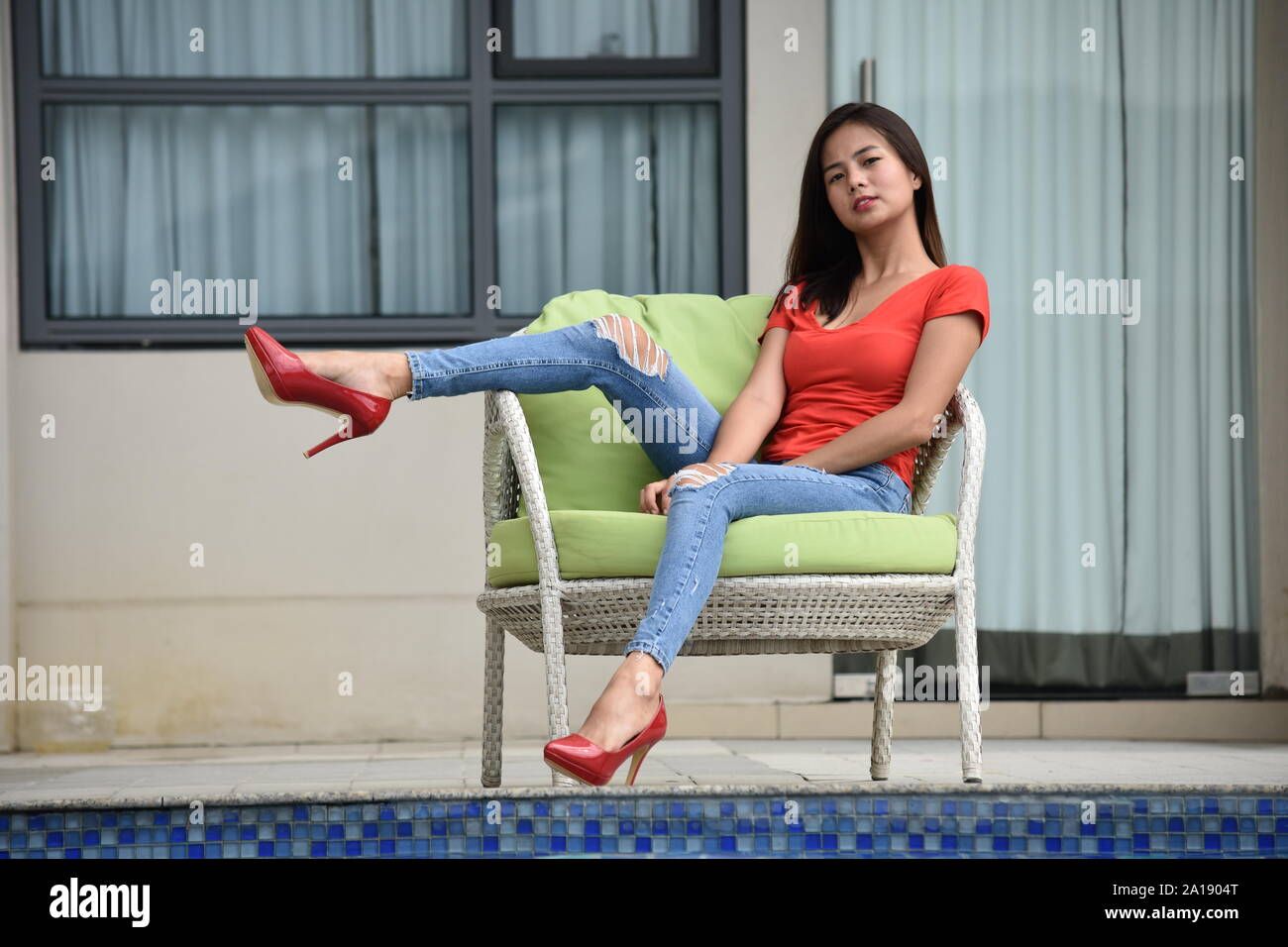 A Relaxing Attractive Female Sitting Stock Photo - Alamy
