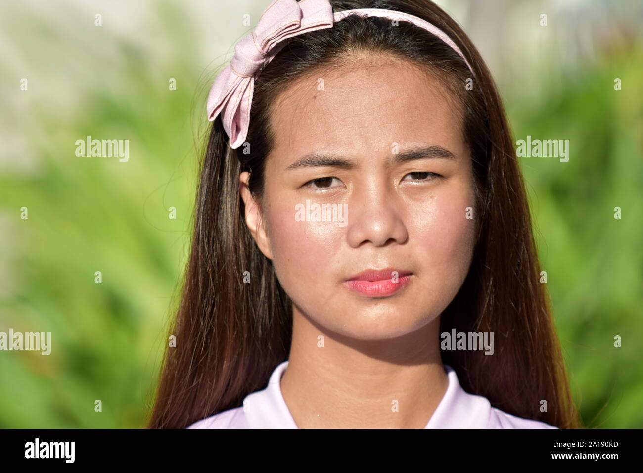Pretty young serious woman hi-res stock photography and images - Alamy